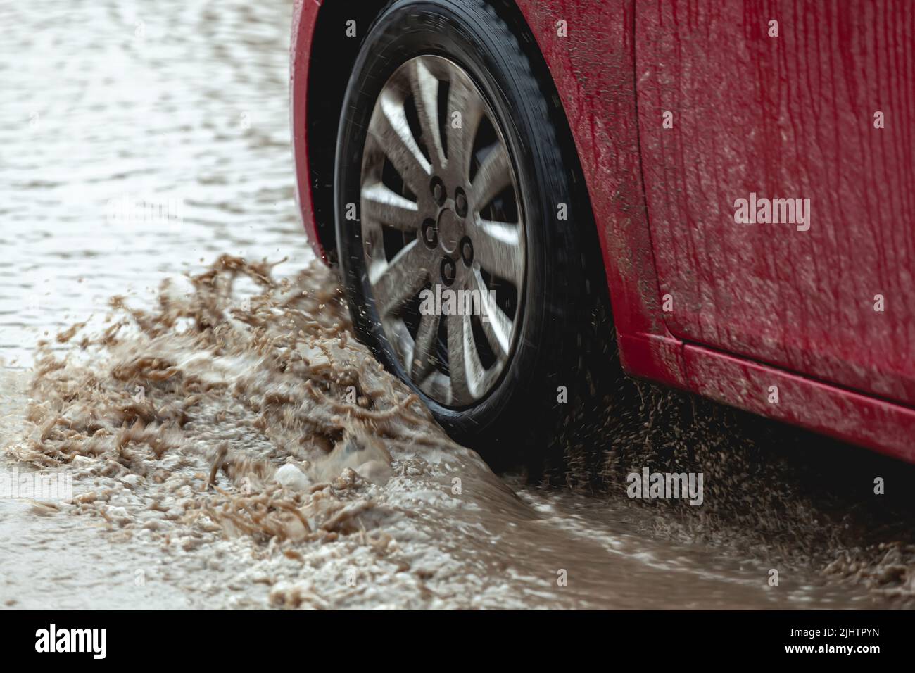 Car stuck in the mud, car wheel in dirty puddle, rough terrain Stock ...