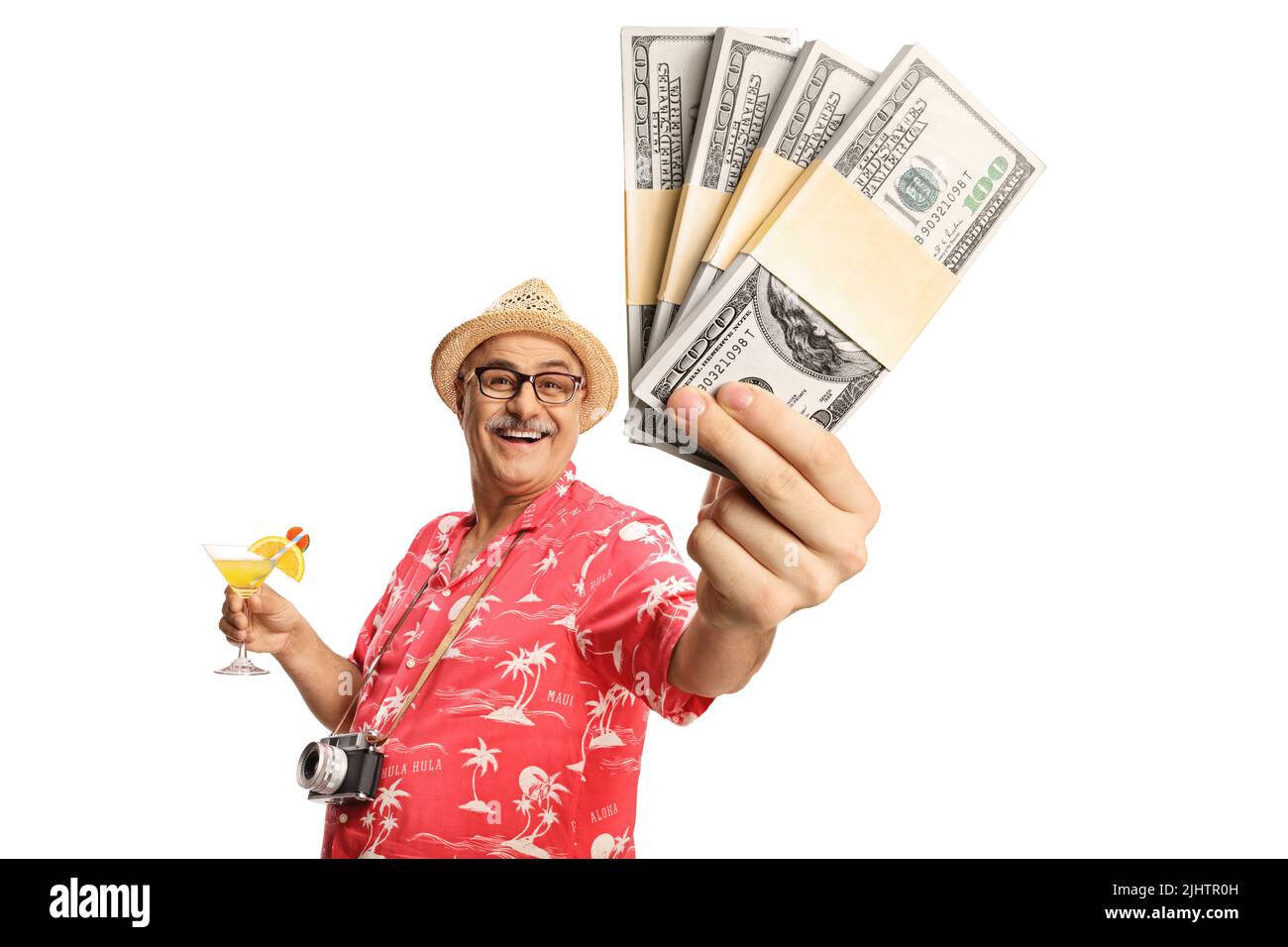 Happy mature male tourist holding a cocktail and showing money isolated ...