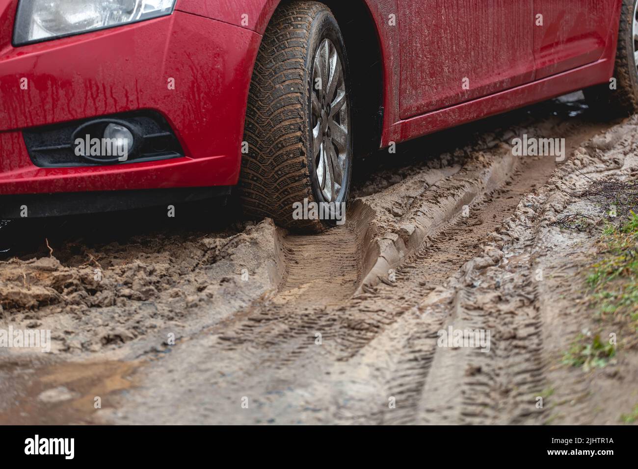 Car stuck in the mud, car wheel in dirty puddle, rough terrain Stock ...