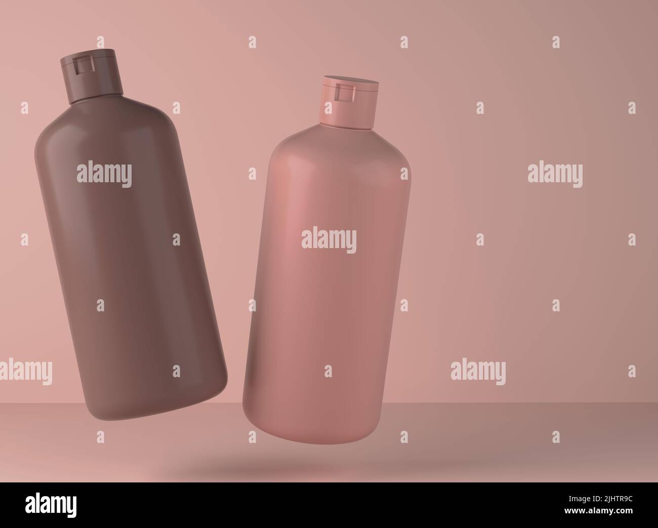 Two brown and beige plastic shampoo bottles floating on studio ...