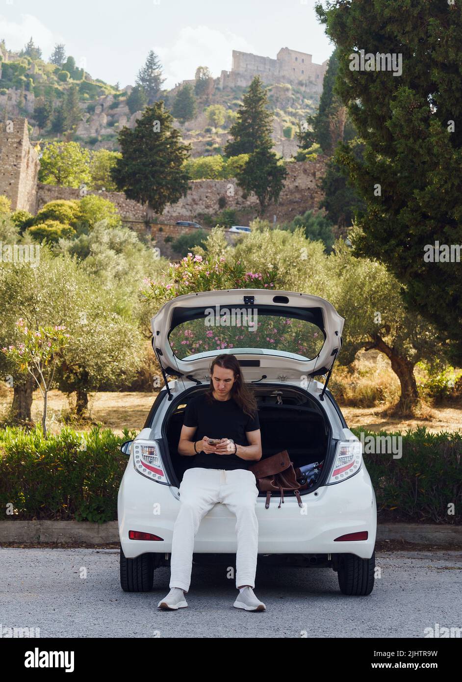 Man on road trip Stock Photo - Alamy