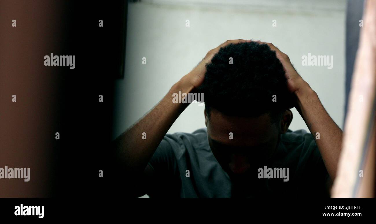 Troubled Black man feeling unhappy and lonely. Desperate frustrated ...