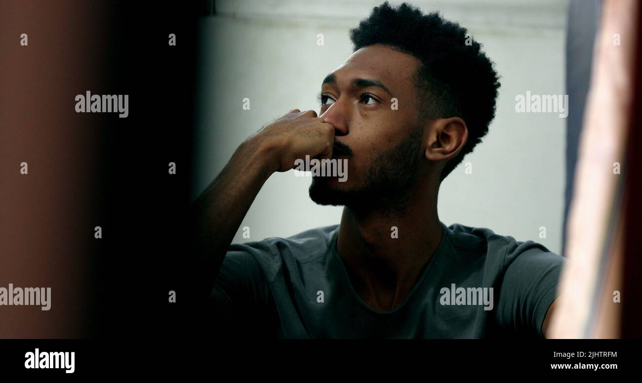 Troubled Black man feeling unhappy and lonely. Desperate frustrated ...
