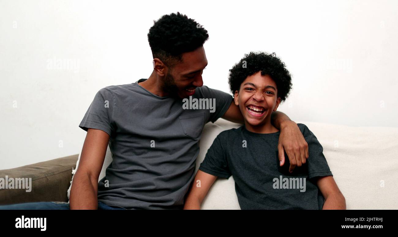 Two brothers relationship laughing and smiling together. Older and ...