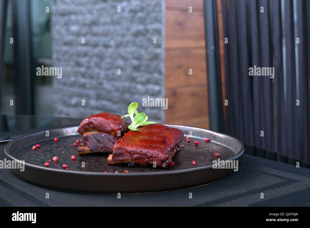 Grilled pork ribs with sweet and sour caramelized grilled sauce, smoke ...