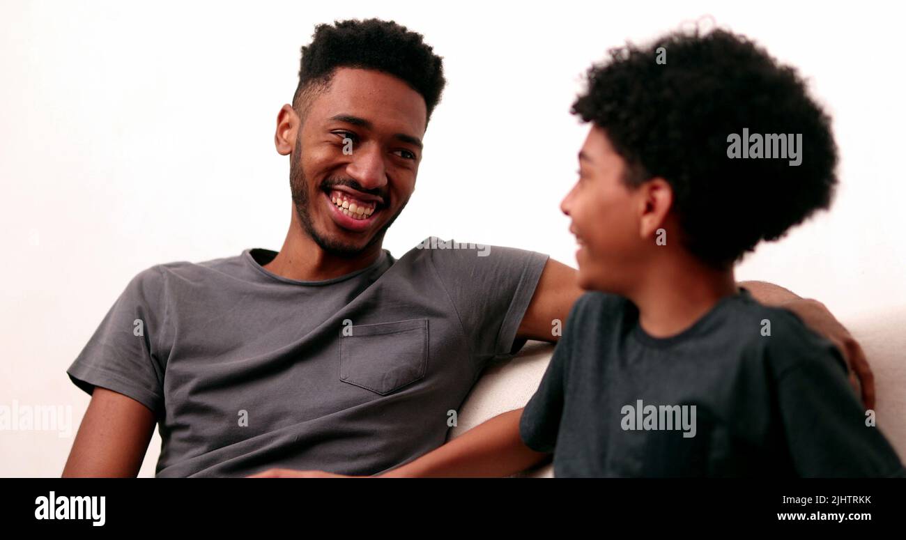 Two brothers talk interaction, black african siblings in conversation ...