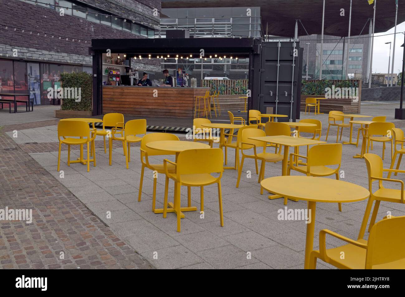 Pop up bar and pretty yellow tables and chairs, Cardiff Bay, Summer ...