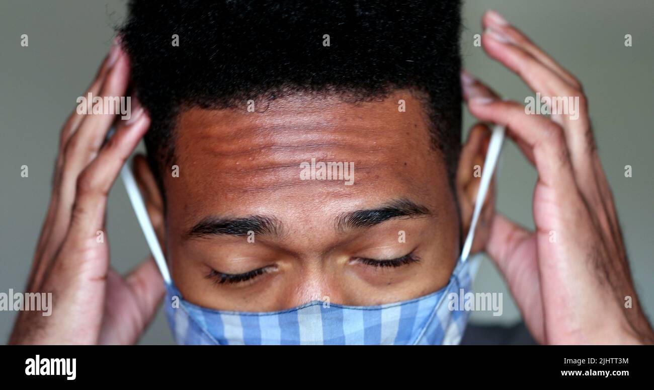 Young man taking off covid hi-res stock photography and images - Alamy