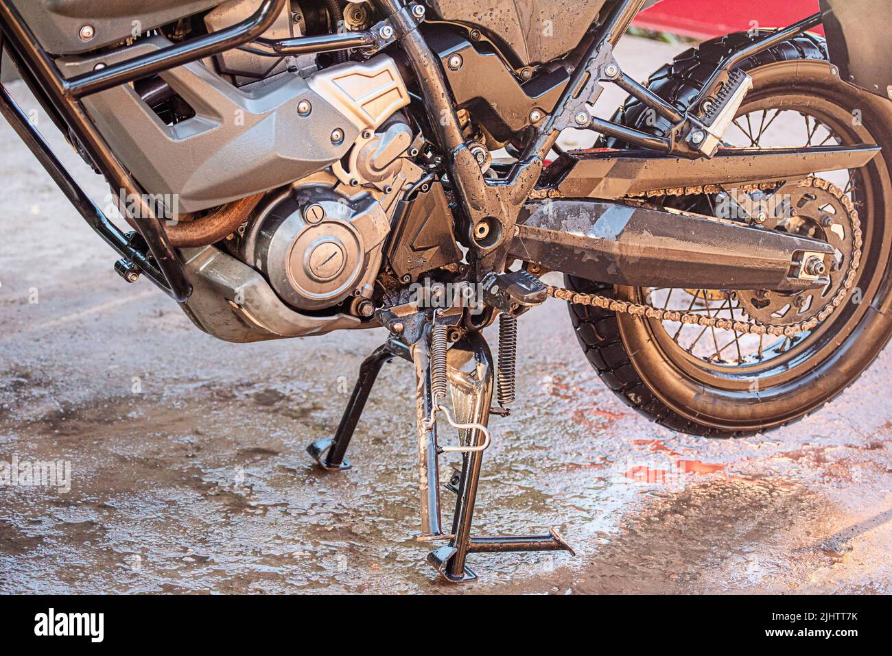 A clean wet motorcycle of the enduro class. Wet bike. Car wash Stock ...