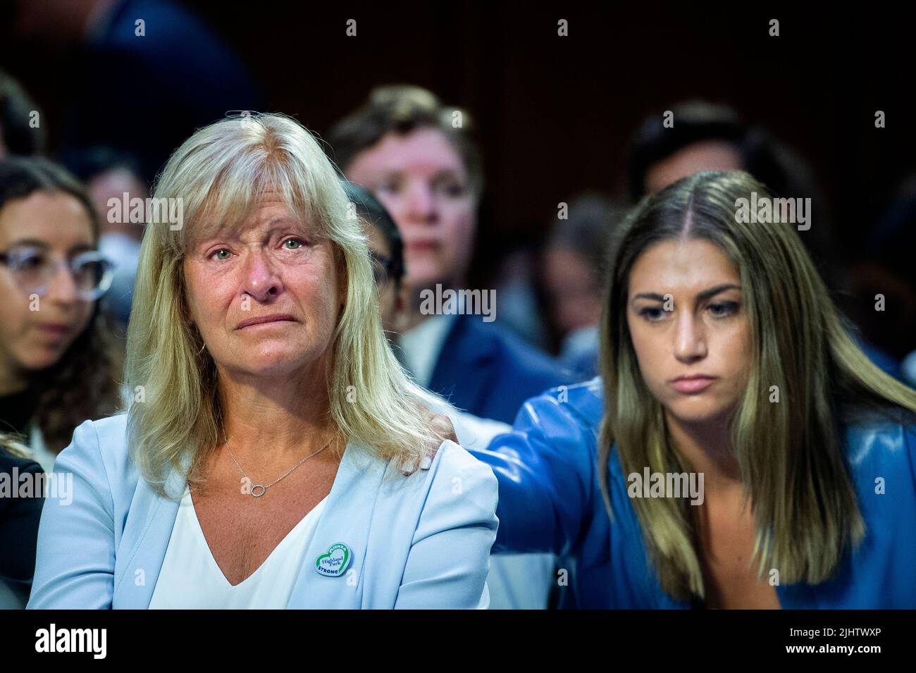 Highland Park City Councilwoman Annette Lidawer, left, is comforted by ...