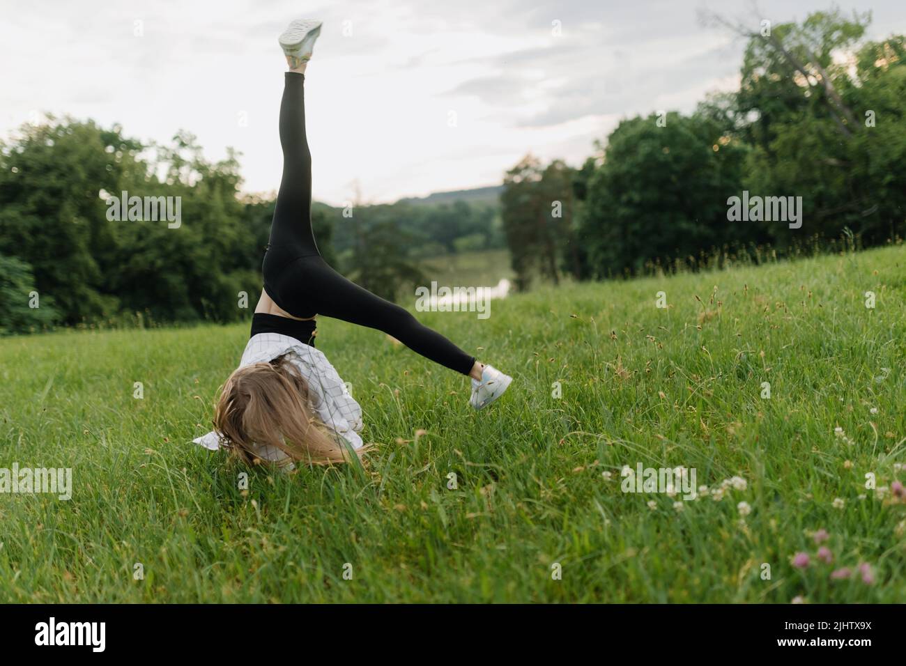 Woman cartwheel hi-res stock photography and images - Alamy