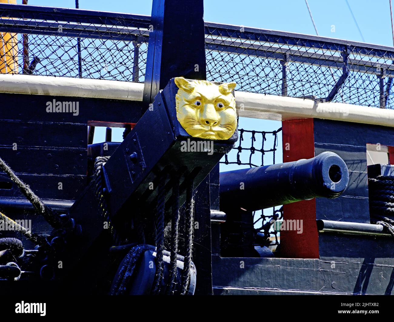 A golden cat figurehead and cannon on HMS Trincomalee it is now over ...