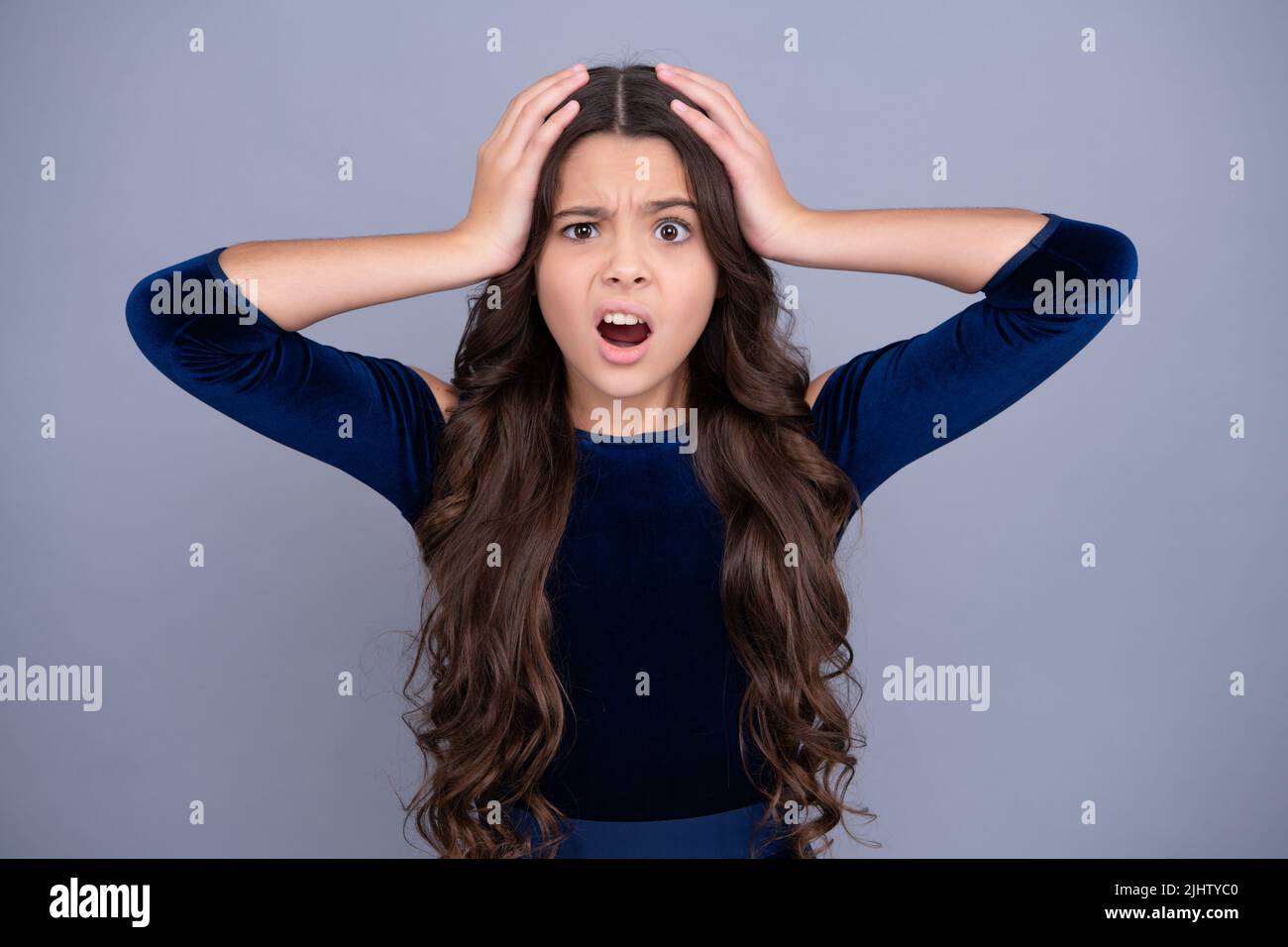 Angry face, upset emotions of teenager girl. Children studio portrait ...