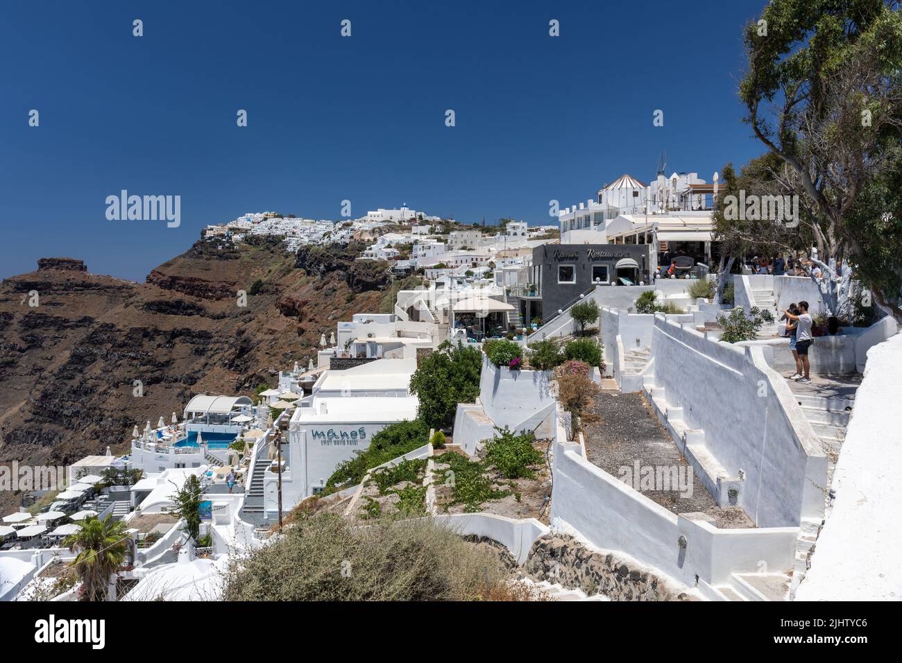 View of whitewashed hotels and apartments in Firostefani and Imerovigil ...