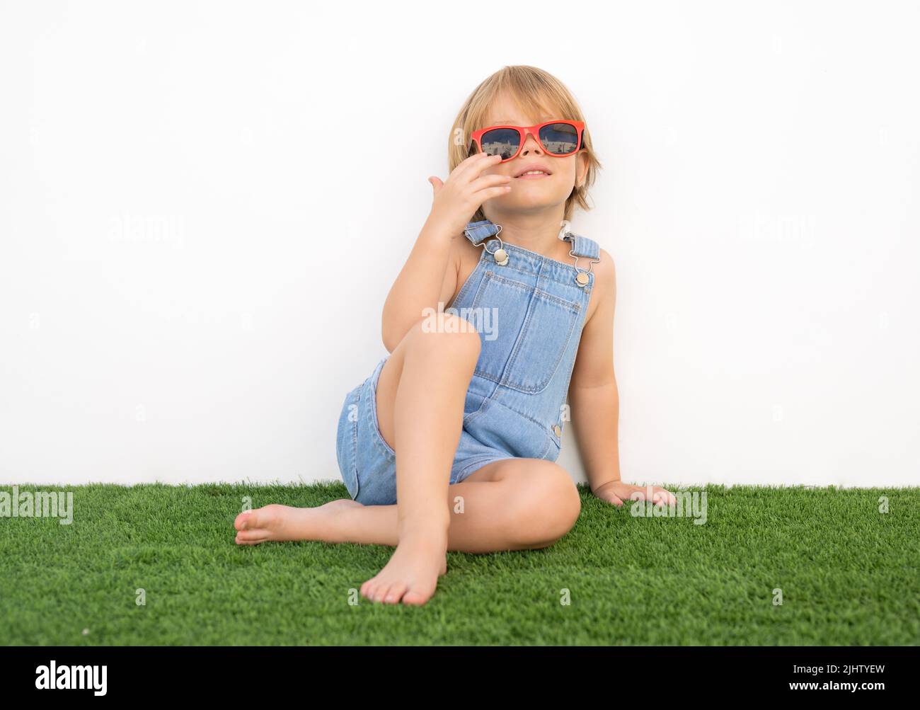 fashionable kid wearing sunglasses in summer park outdoors Stock Photo ...