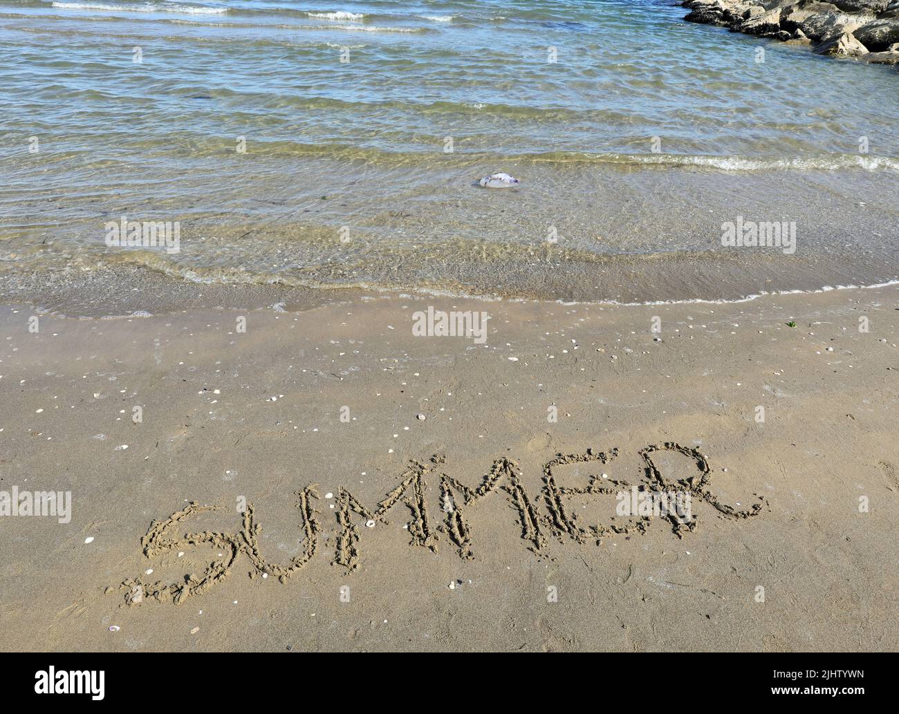June written on sand summer hi-res stock photography and images - Alamy