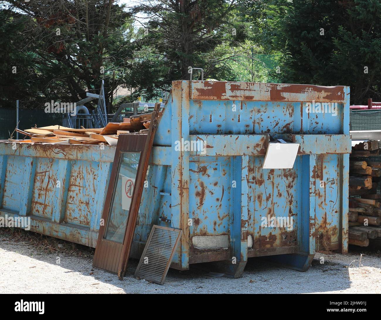 large blue container for the collection of wood and wooden window ...