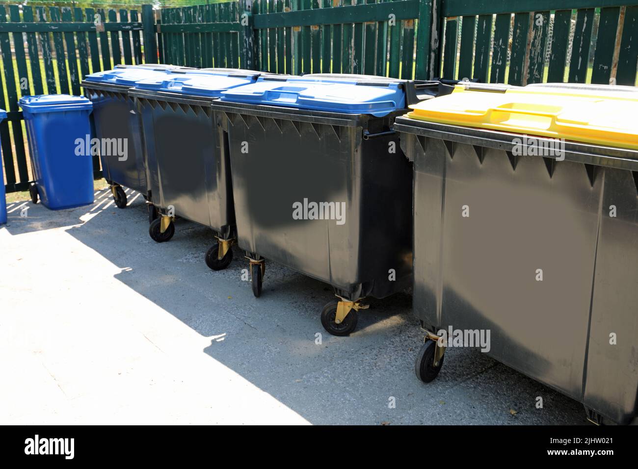 Many plastic boxes for the separate collection of waste in the area ...