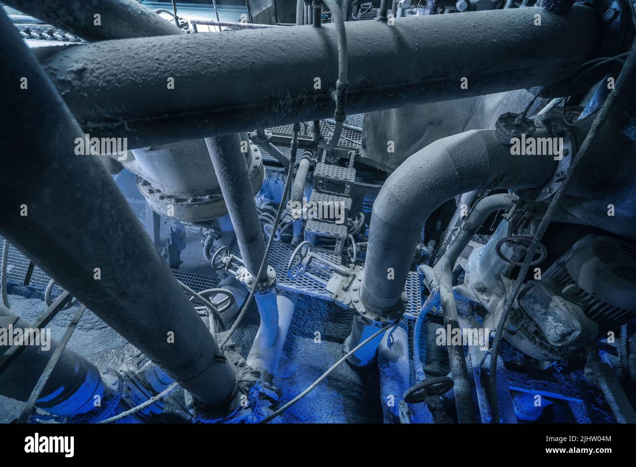 Steel pipes and tubes in waste paper recycling factory. Paper Mill ...