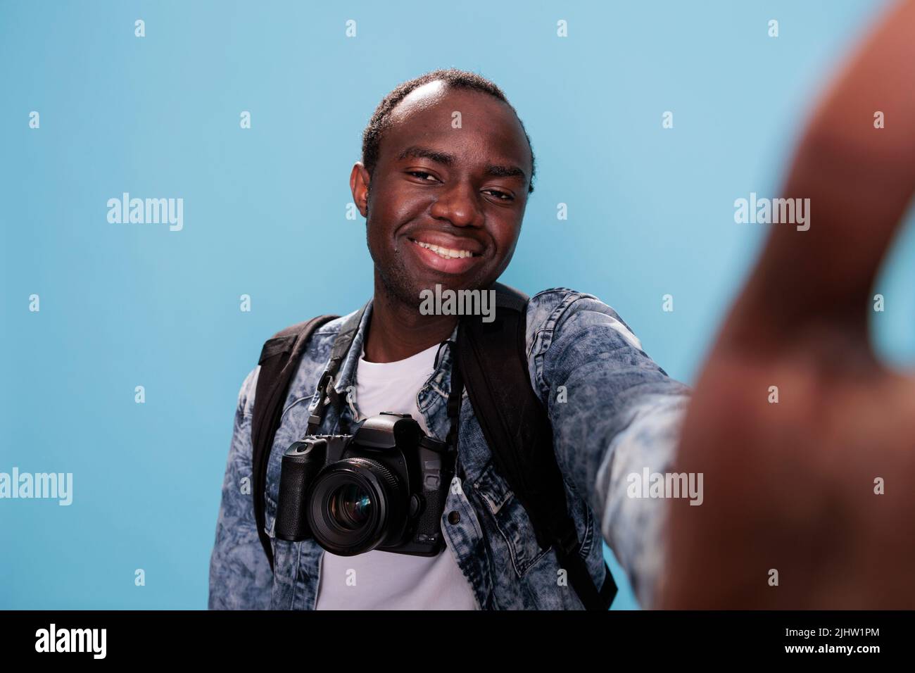 Happy photography enthusiast having professional photo device and ...