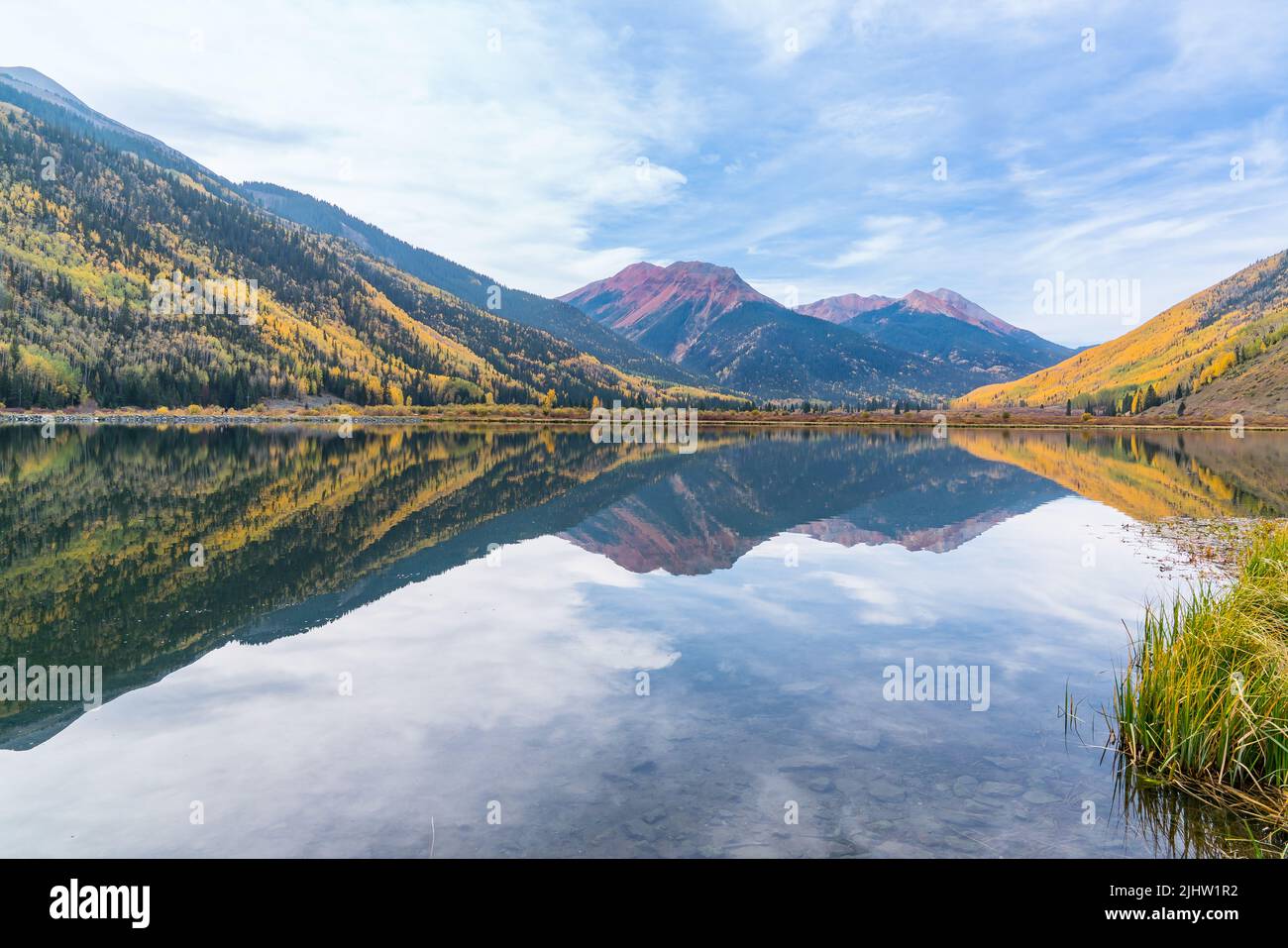 Reflection of autumn aspen trees along Crystal Lake along Red Mountain ...