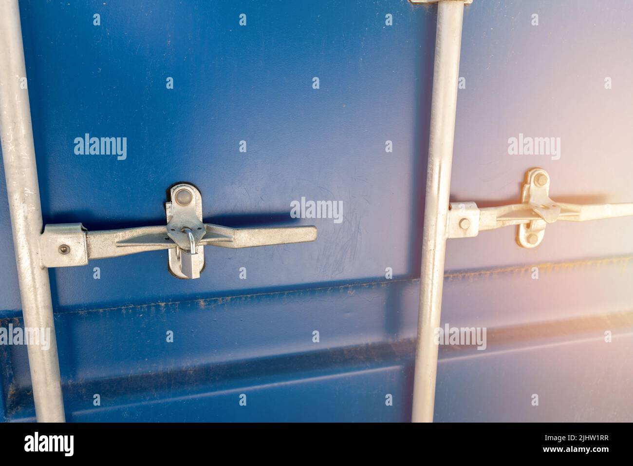 Close-up detail view of big blue metal freight cargo container door ...