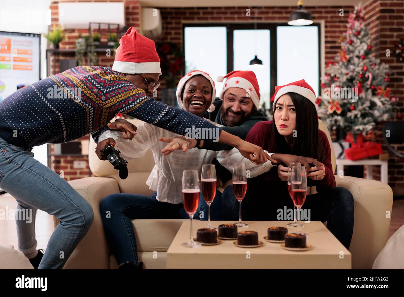 Cheerful coworkers playing video games hi-res stock photography and ...