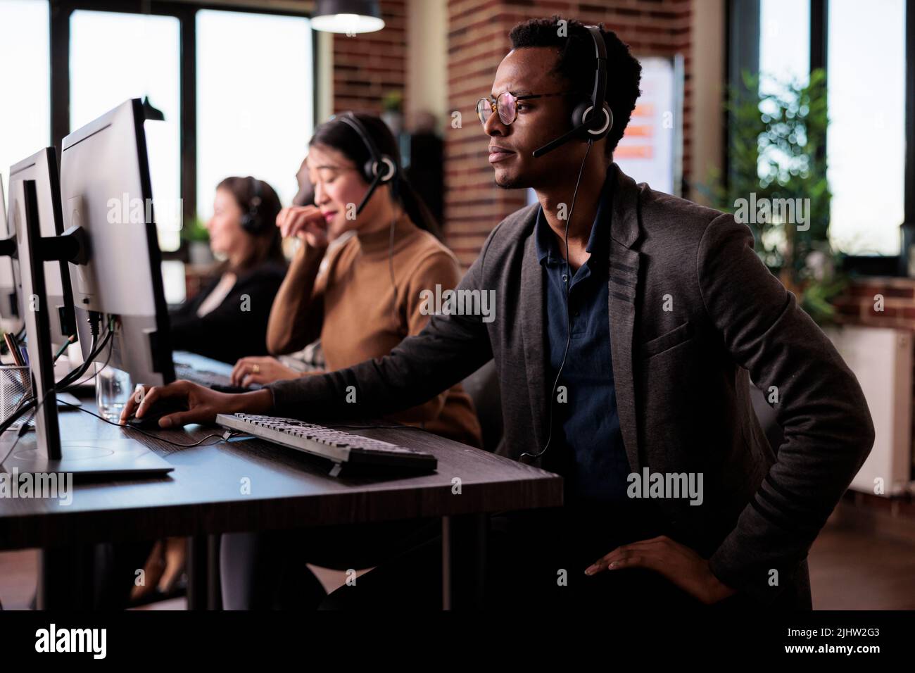 Male employee helping woman customer hi-res stock photography and ...