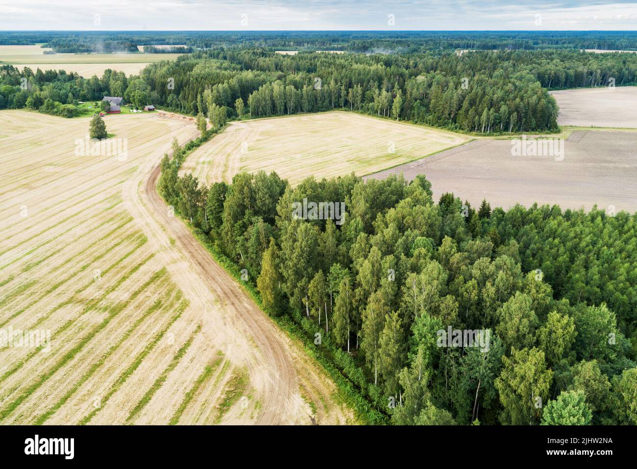 An aerial of a mosaic late summer rural landscape with crop fields and ...