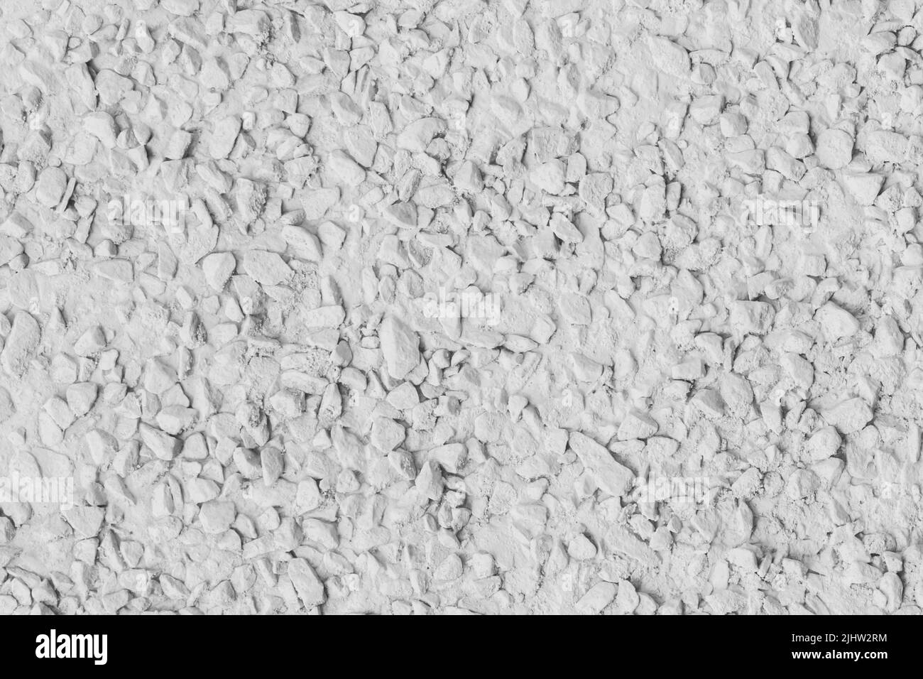 White paint on stone pebble surface solid texture wall background Stock ...