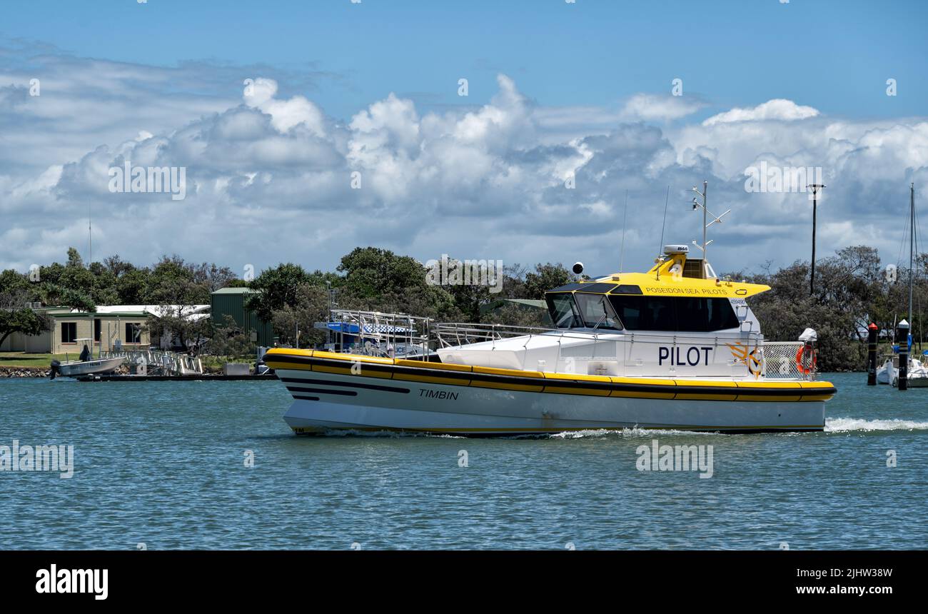A commercial yellow pilot boat returning to the port in Mooloolaba ...