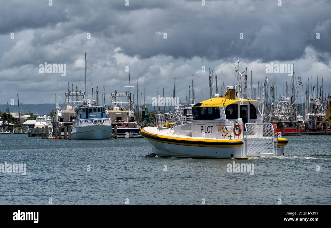 A commercial yellow pilot boat returning to the port in Mooloolaba ...
