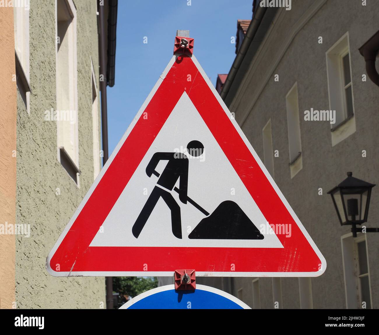Warning signs, road works men at work traffic sign Stock Photo - Alamy