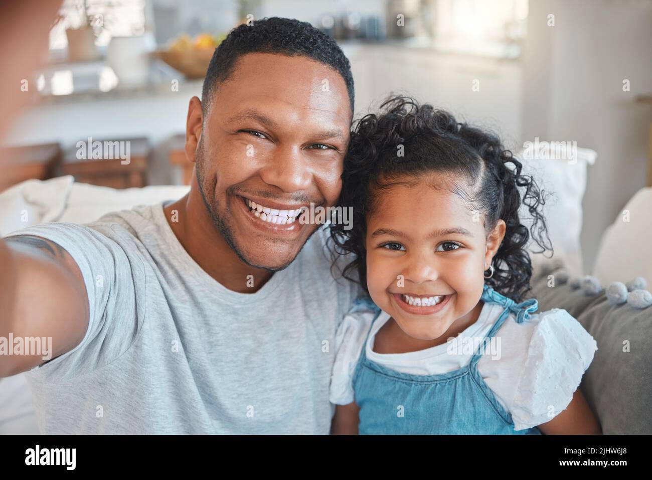 She looks just like her dad. a young man taking a selfie with his ...
