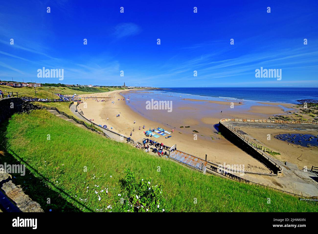 Tynemouth Long sands beach wideangle vista with canoeists surfers deep ...