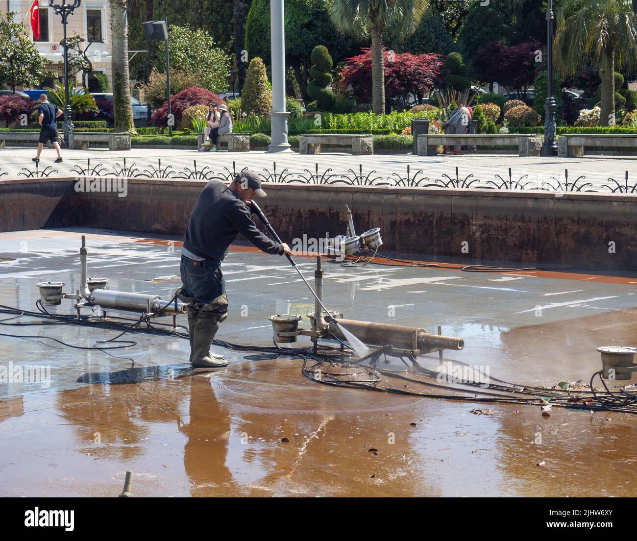 Batumi, Georgia. 05.23.2022 The worker cleans the mechanism of the ...