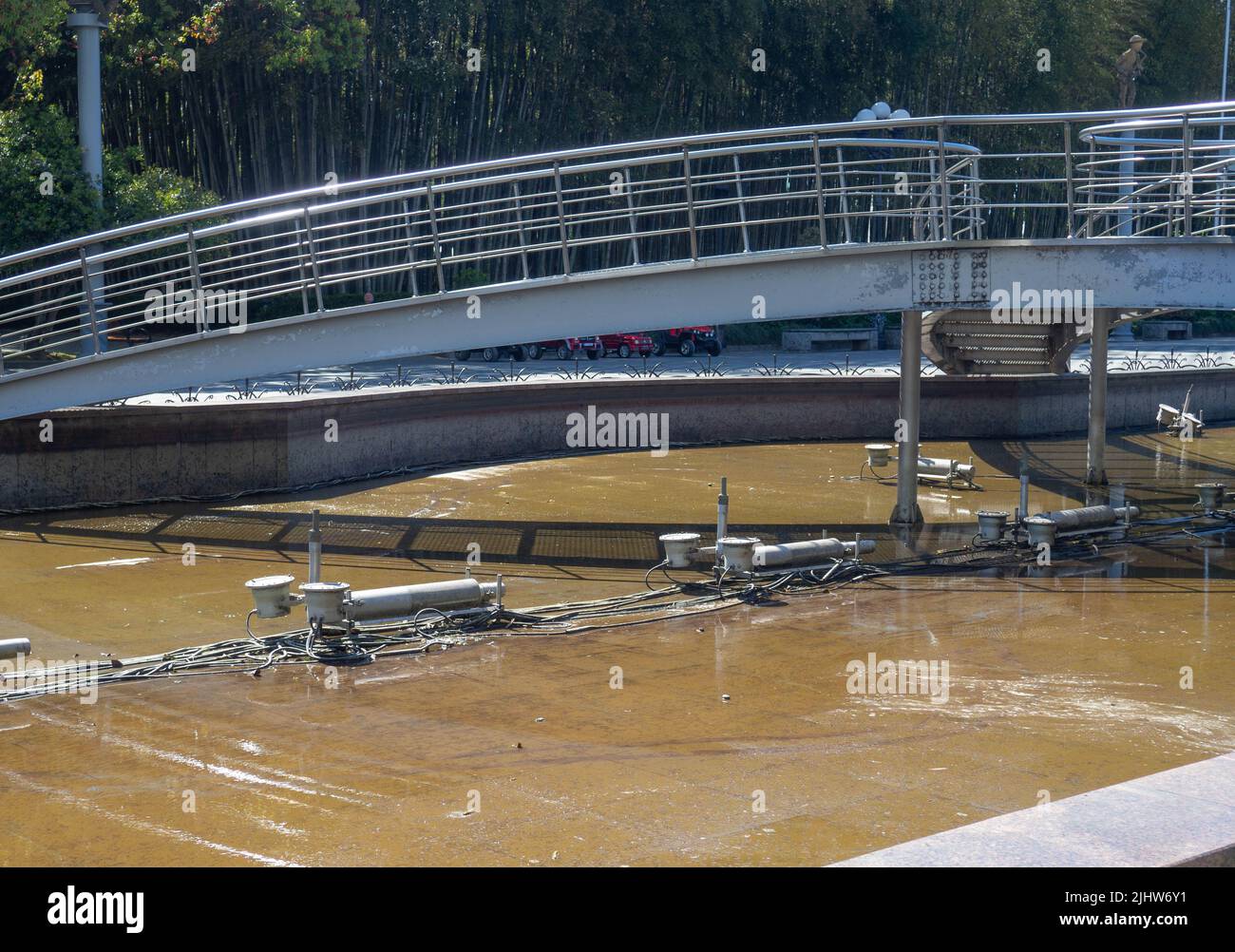Drained. Sechanisms of the dancing fountain. Cleaning work. Dirty ...