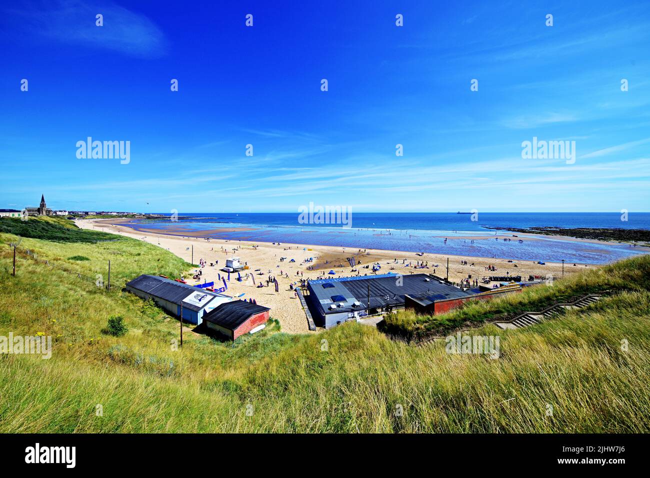 Tynemouth Long sands beach wideangle vista with canoeists surfers ...