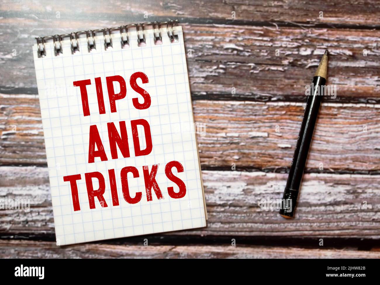 Tips and tricks written on book with wooden background Stock Photo - Alamy
