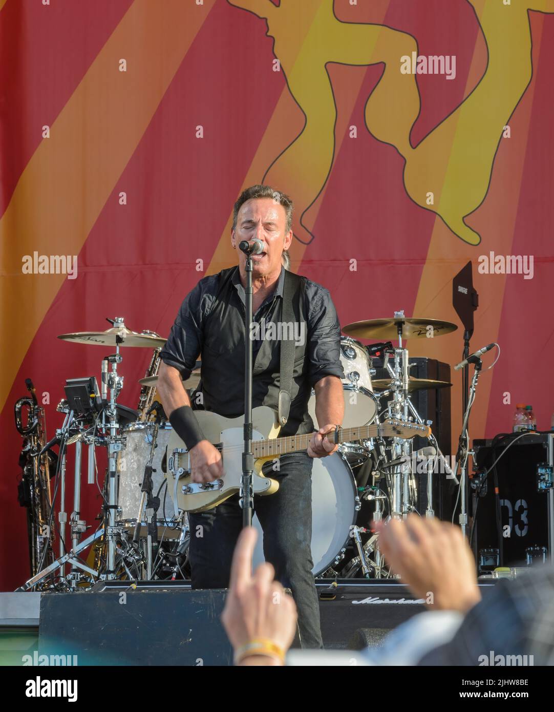 Bruce Springsteen sings and plays guitar at the New Orleans Jazz and ...