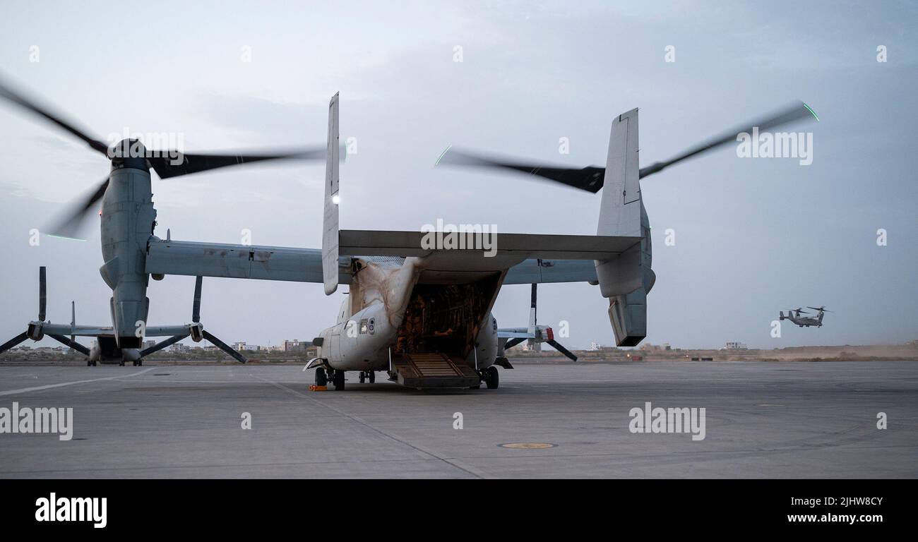 U.S. Marine Corps MV-22 Ospreys assigned to Marine Medium Tiltrotor Squadron (VMM) 163 sit ...