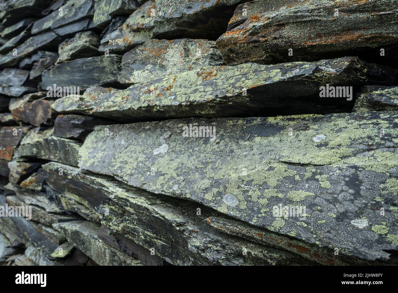 stone wall background from weathered slate stones Stock Photo - Alamy