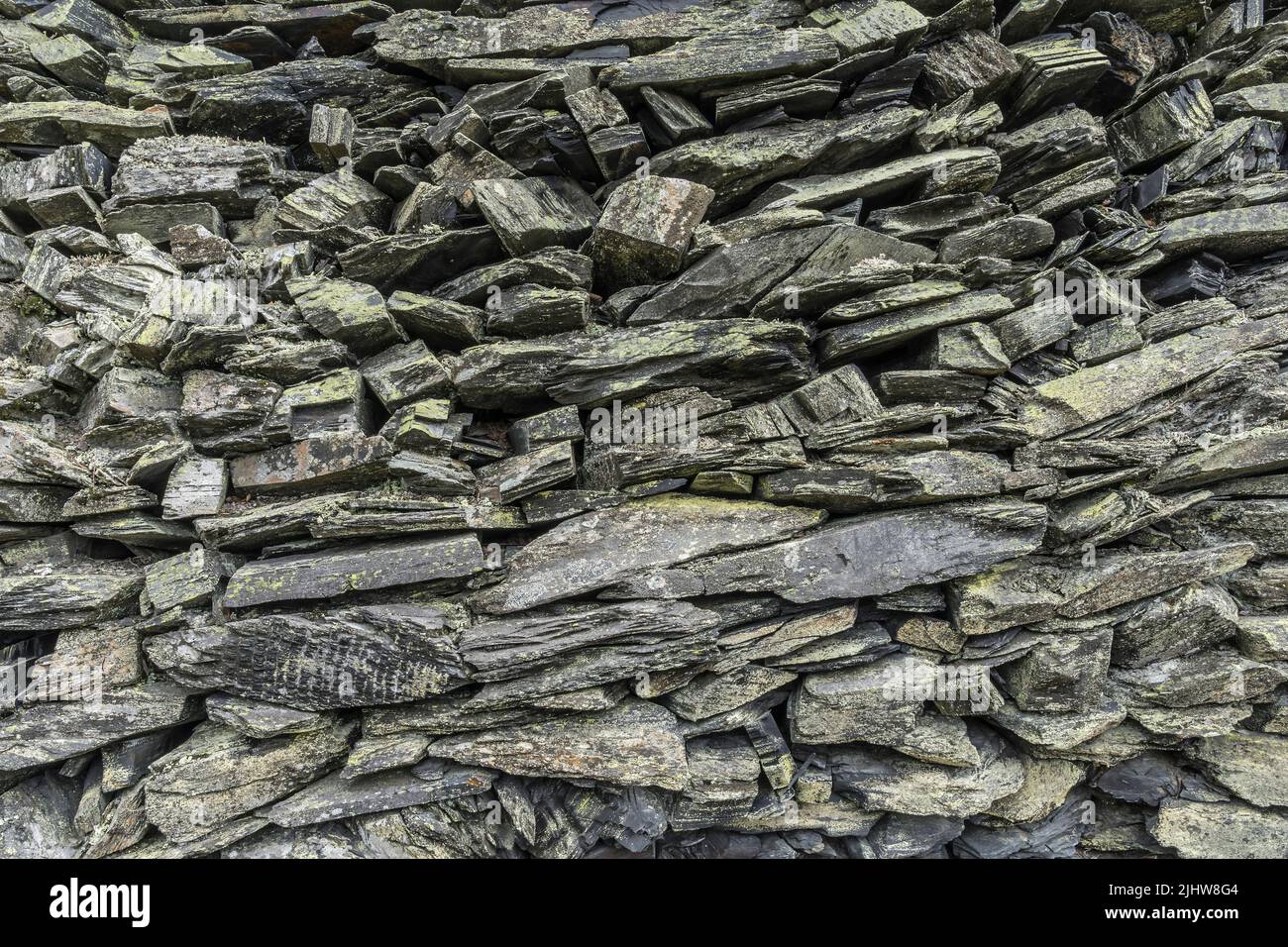 stone wall background from weathered slate stones Stock Photo - Alamy