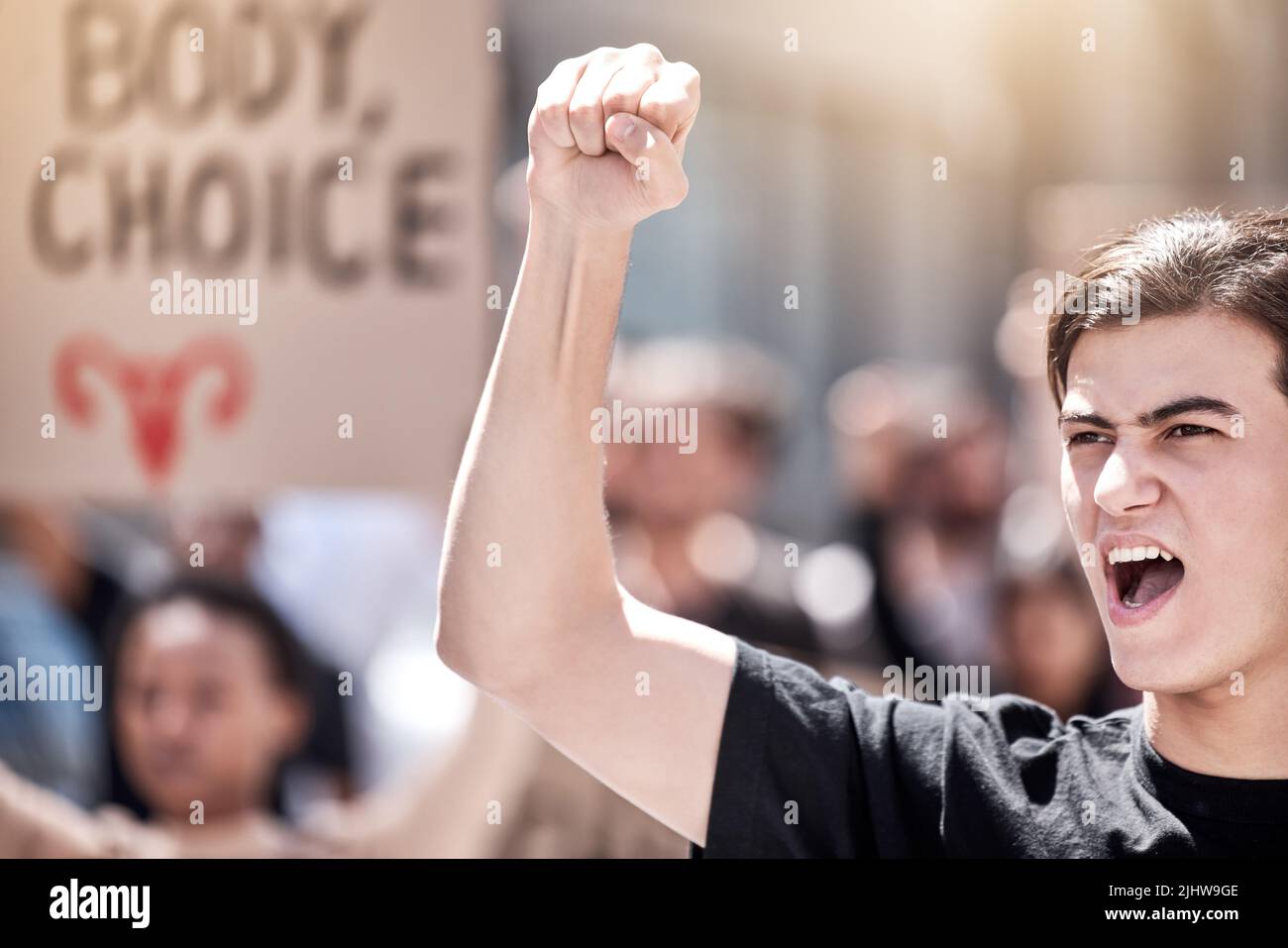 Raising our voices to bring change. a young man shouting during a ...