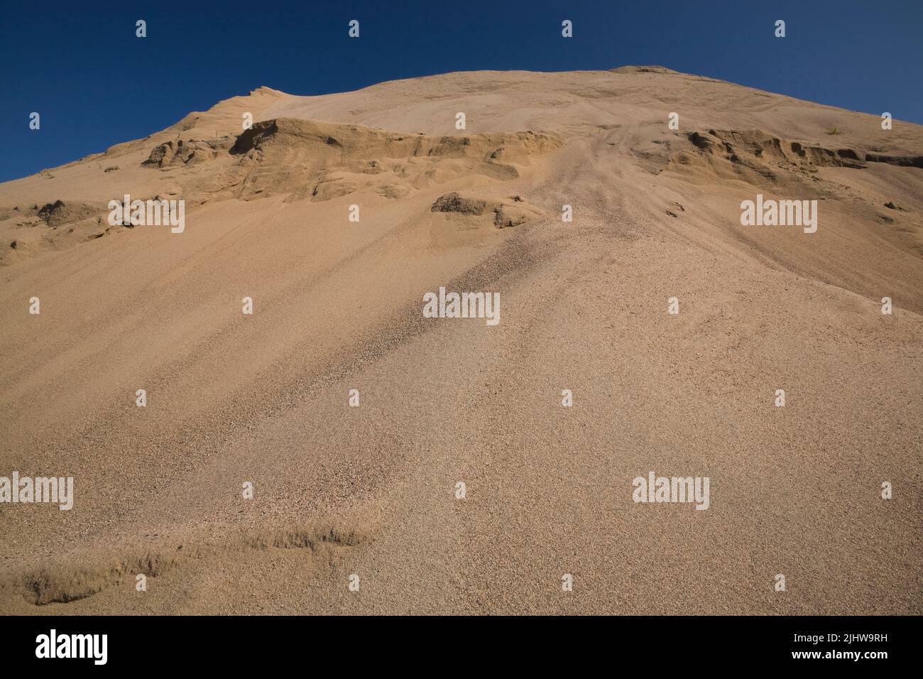 Mound of excavated fine sand in commercial sand pit Stock Photo - Alamy