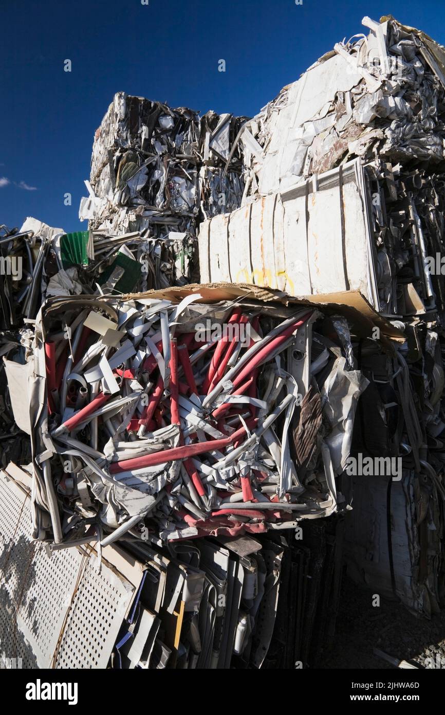 Bales of crushed and compacted pieces of various metals at recycling ...