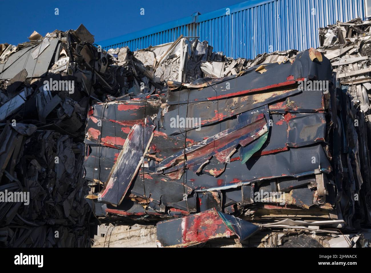 Bales of crushed and compacted pieces of various metals at a recycling ...