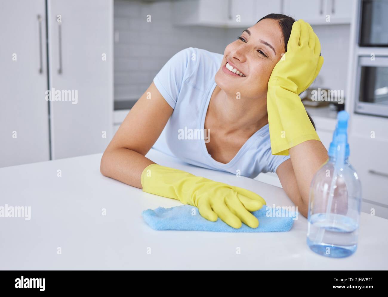 Dreaming of a futuristic self-cleaning home. a young woman smiling ...