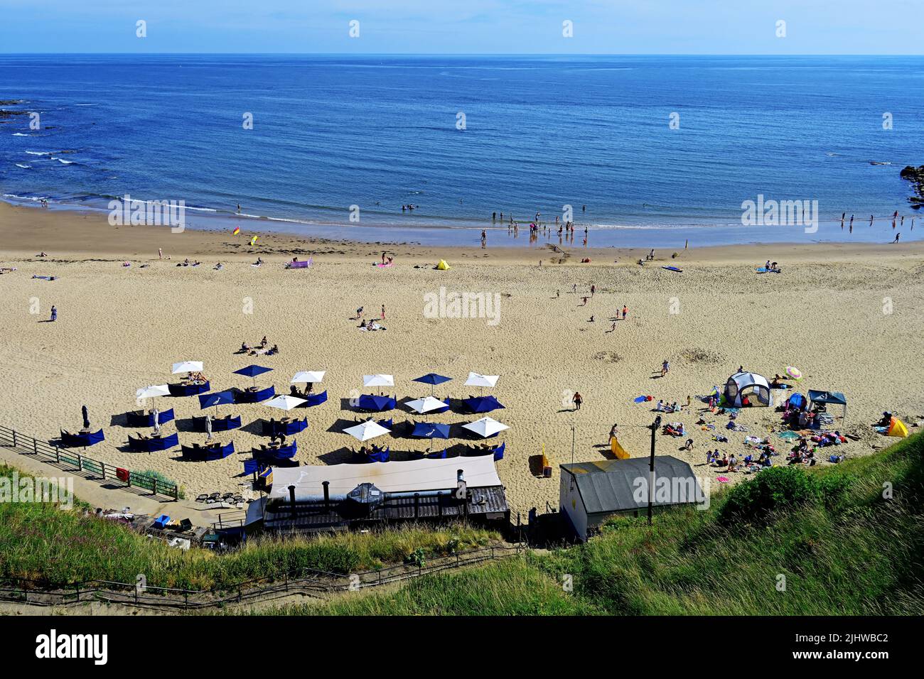 King Edwards Bay beach Tynemouth and Rileys Fish Bar restaurant people ...