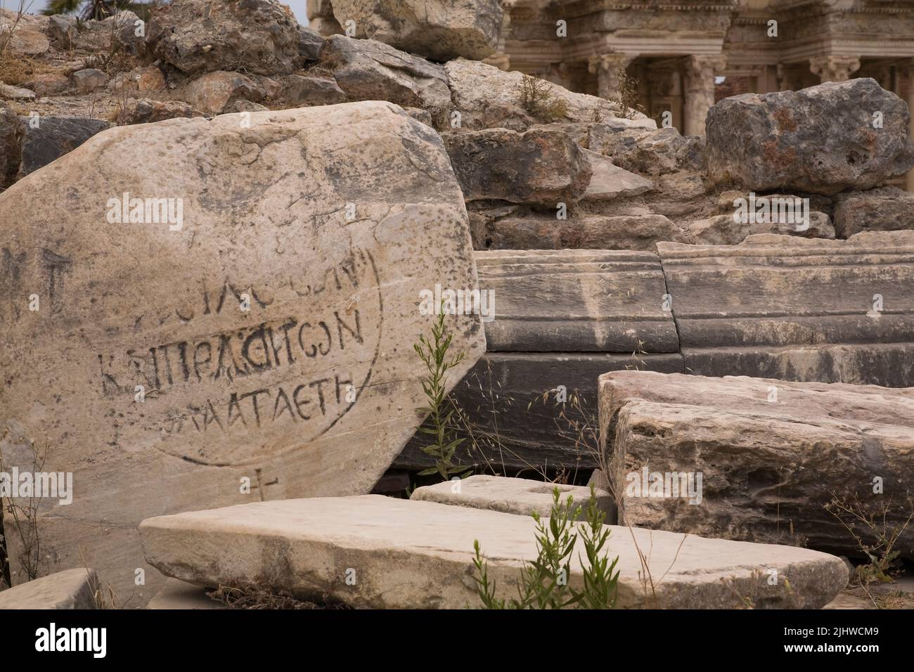 Greek inscription on a block of marble at the ancient ruins of Ephesus ...